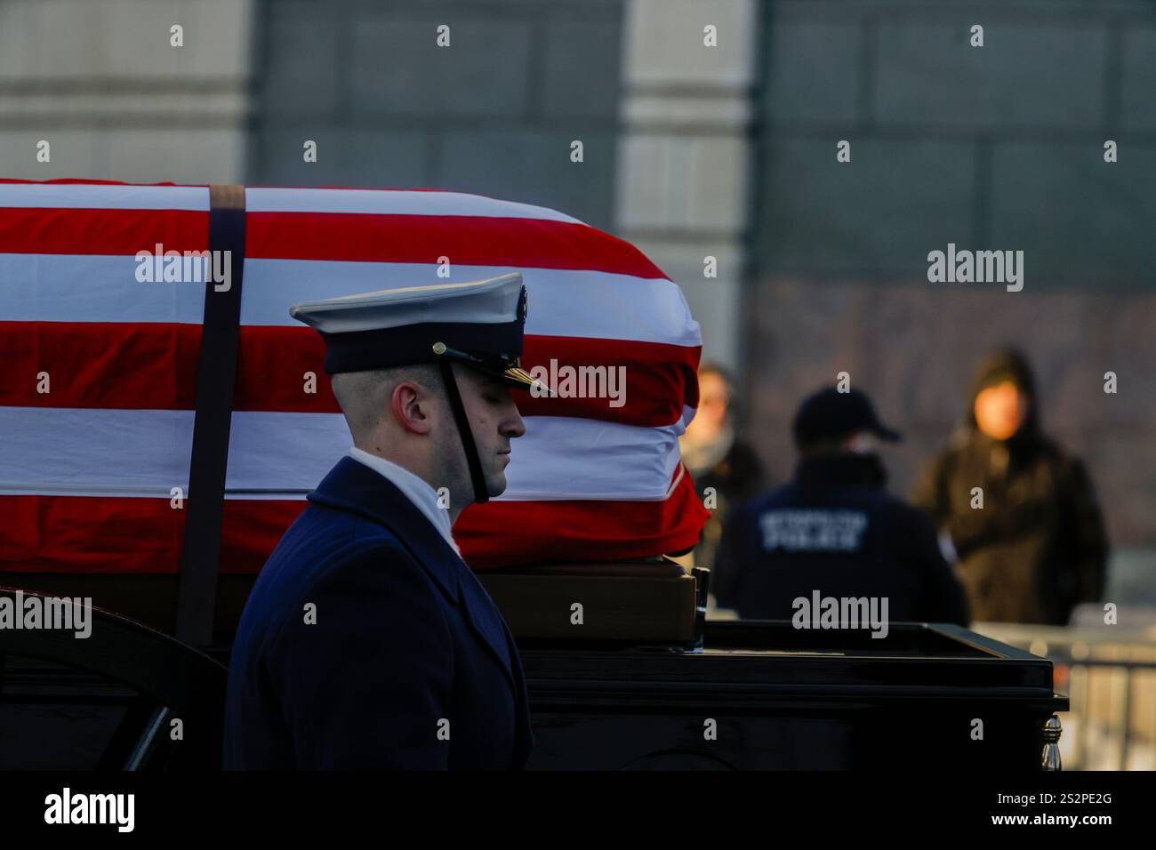 The U.S. Army's Caisson Detachment carries the casket of Jimmy Carter ...