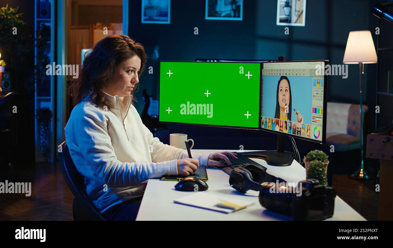 Photo Editor Using Green Screen Monitor To Look At Editorial Pictures Taken With Professional