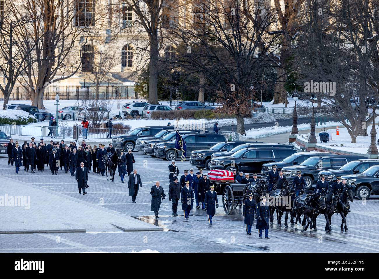 The casket of former US President Jimmy Carter arrives on a horse-drawn ...