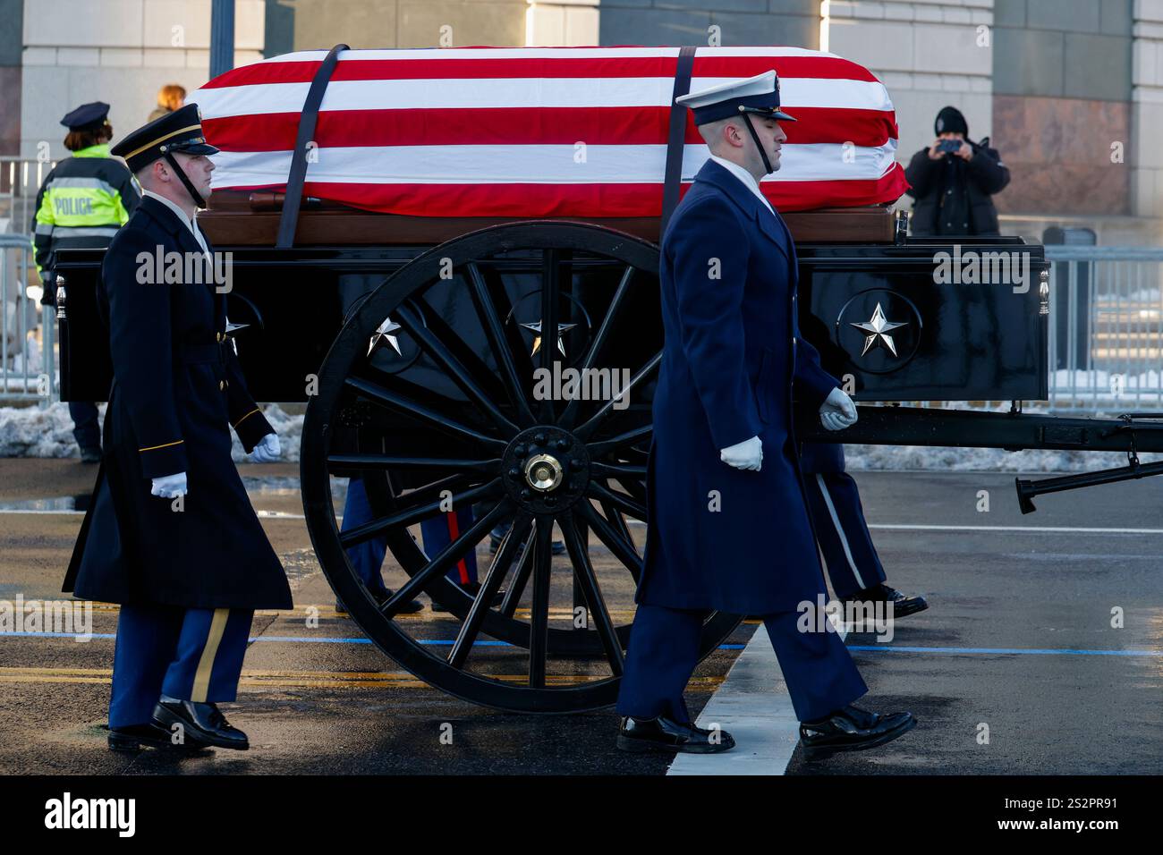 The U.S. Army's Caisson Detachment carries the casket of Jimmy Carter ...
