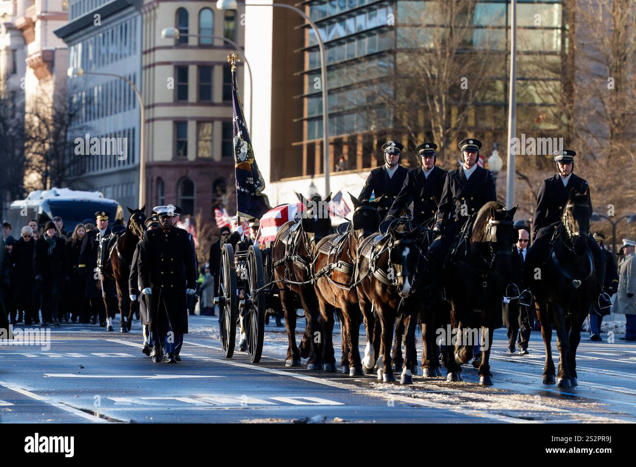 The U.S. Army's Caisson Detachment carries the casket of Jimmy Carter ...