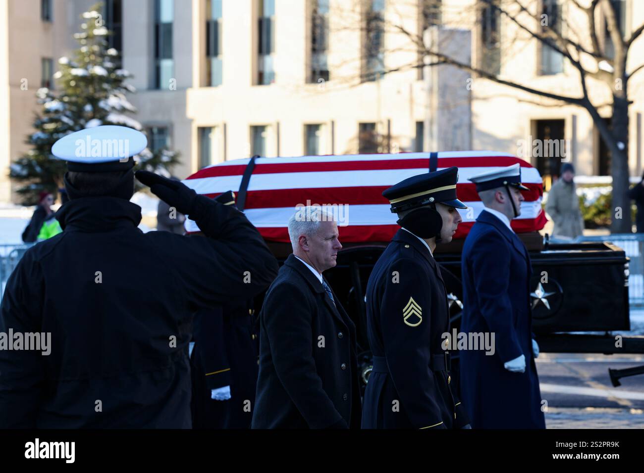 The U.S. Army's Caisson Detachment carries the casket of Jimmy Carter ...