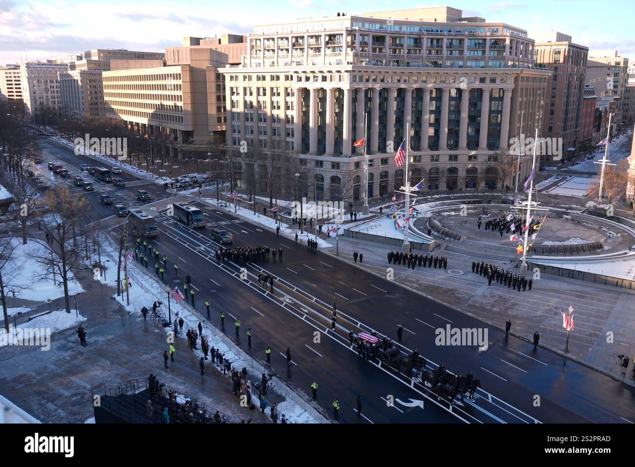 The flag-draped casket of former President Jimmy Carter travels in a ...