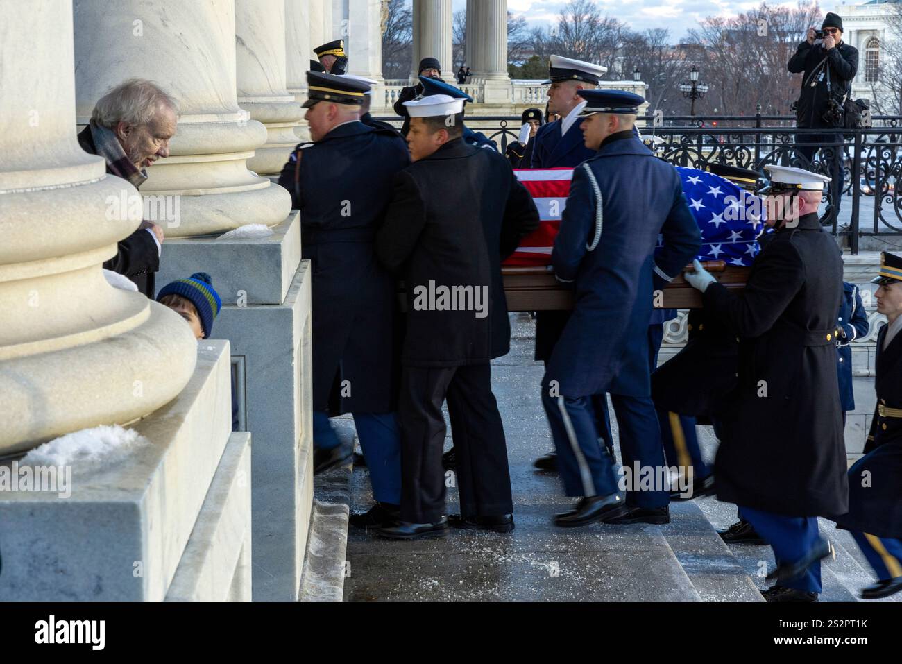 A joint services body bearer team moves the casket of former President ...