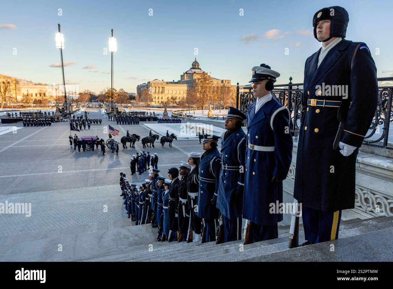 A joint services body bearer team prepares to move the casket of former ...