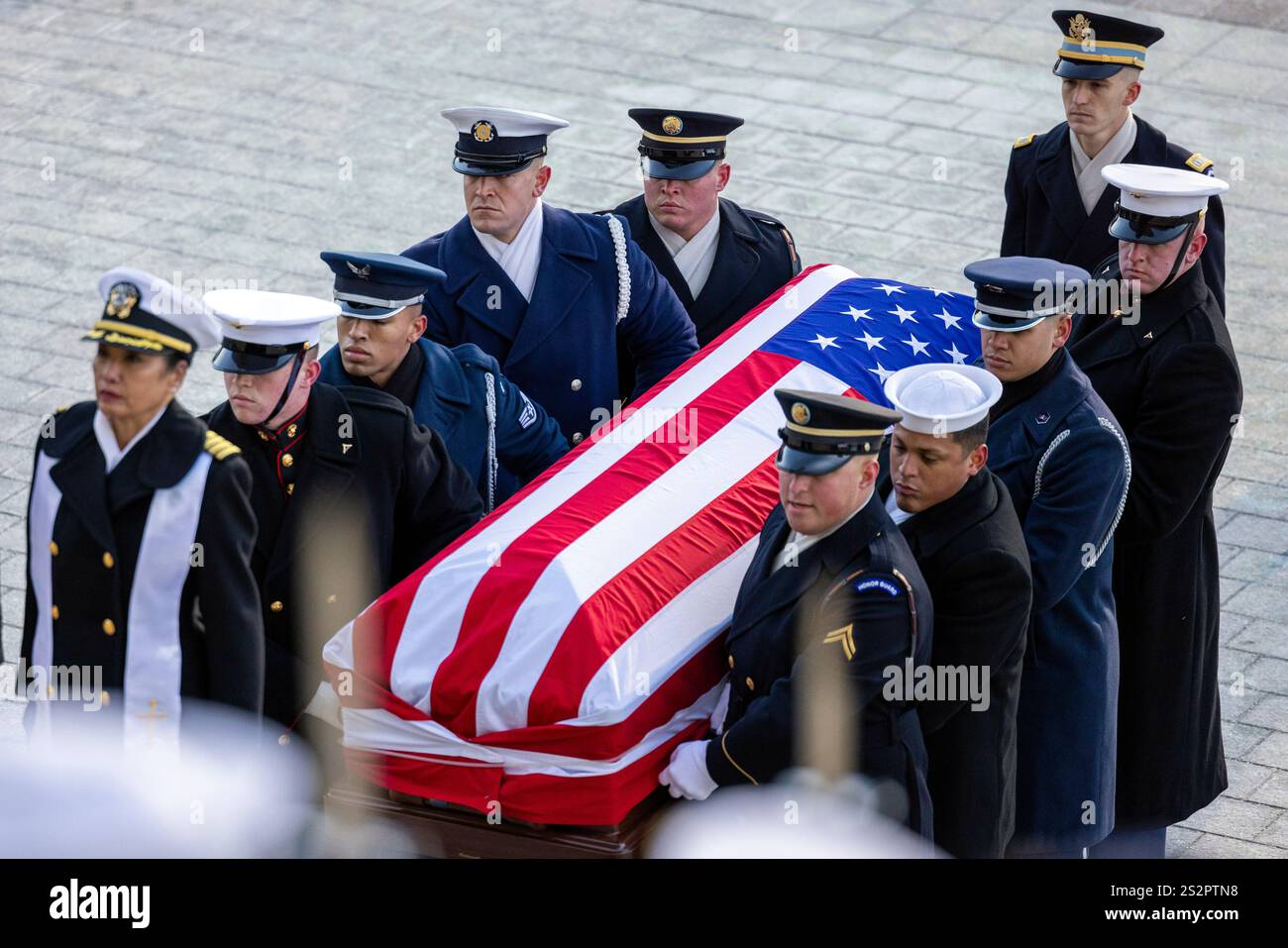 A joint services body bearer team moves the casket of former President ...