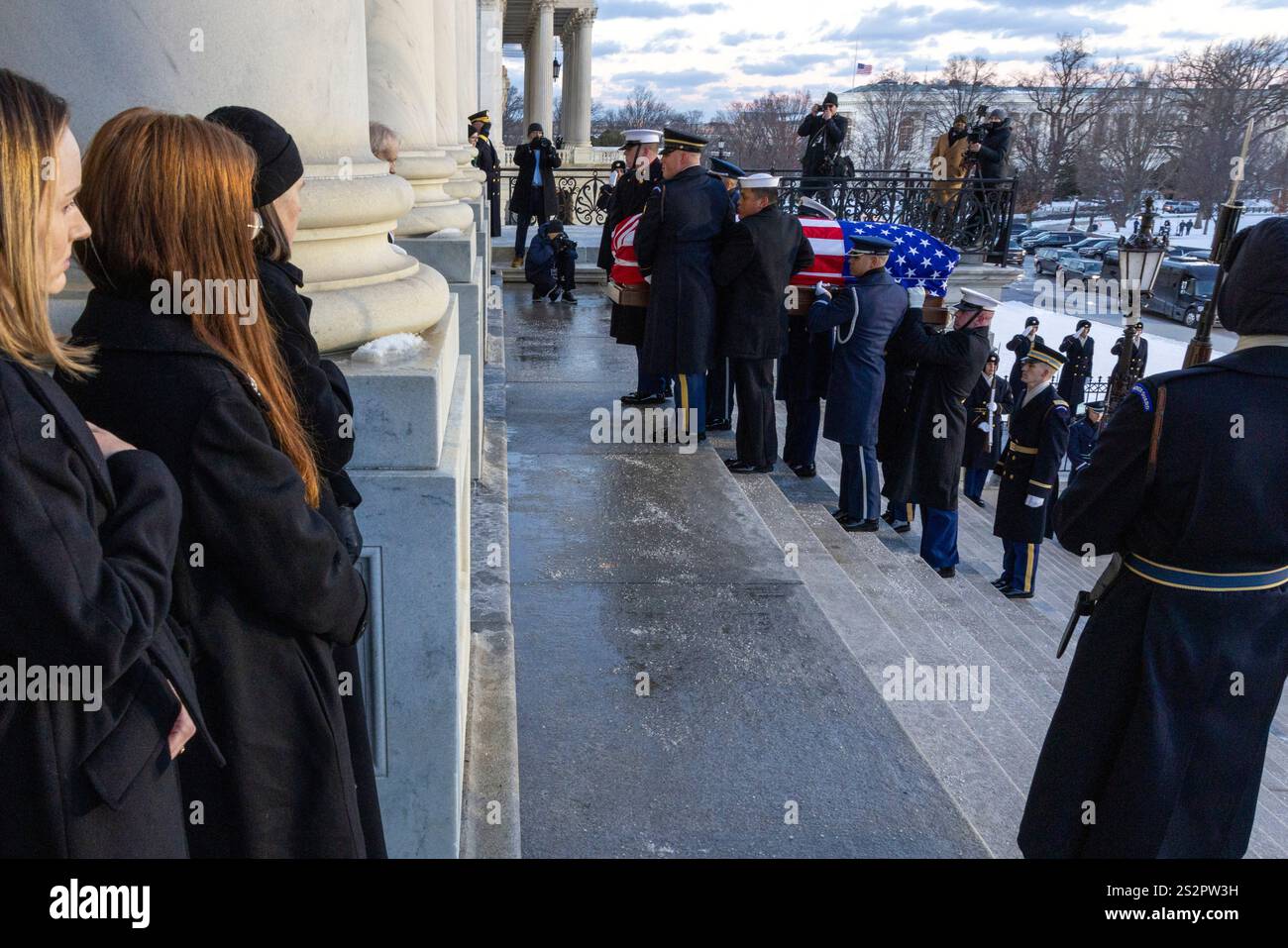 A joint services body bearer team moves the casket of former President ...