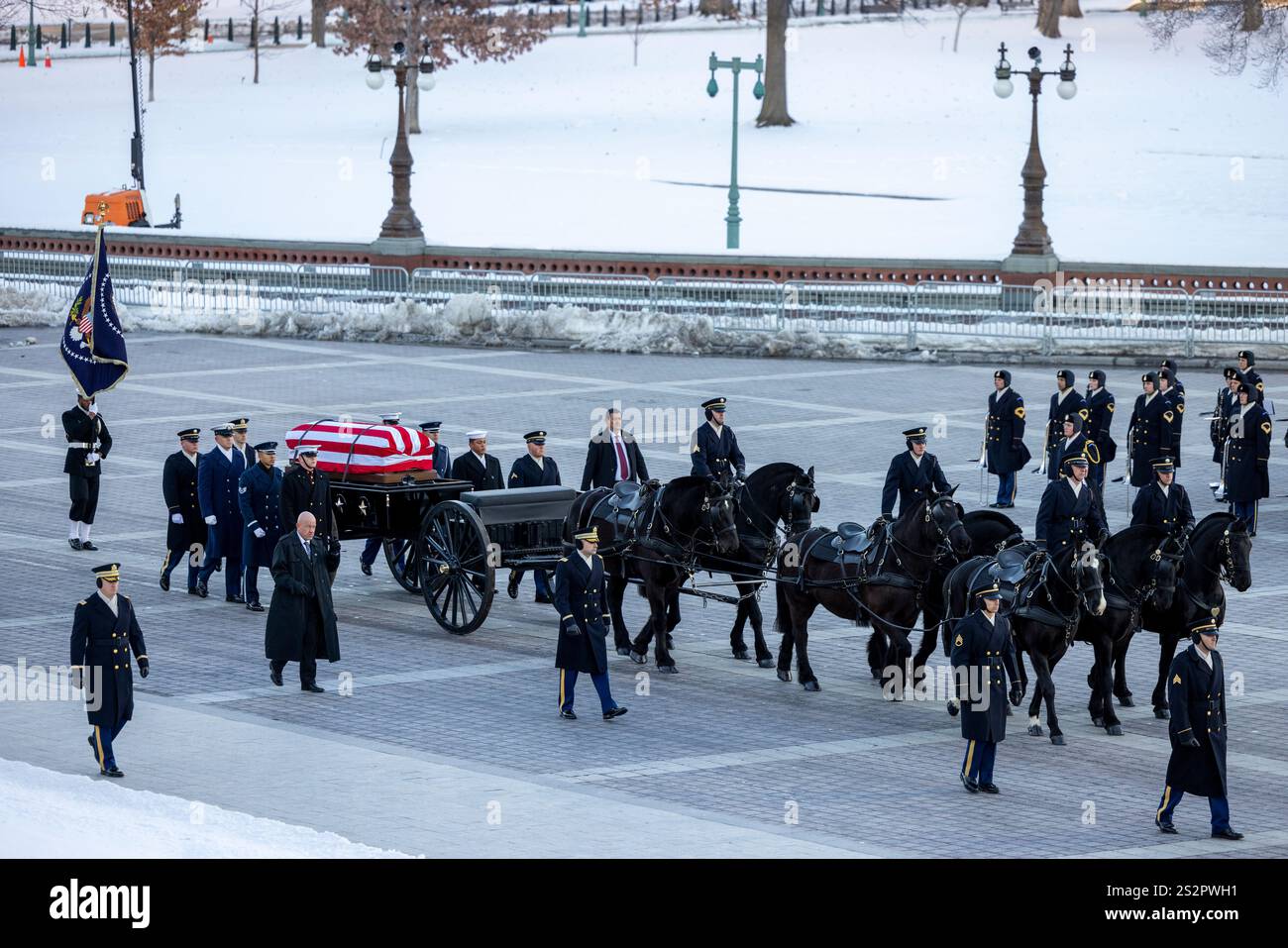 The casket of former US President Jimmy Carter arrives on a horse-drawn ...