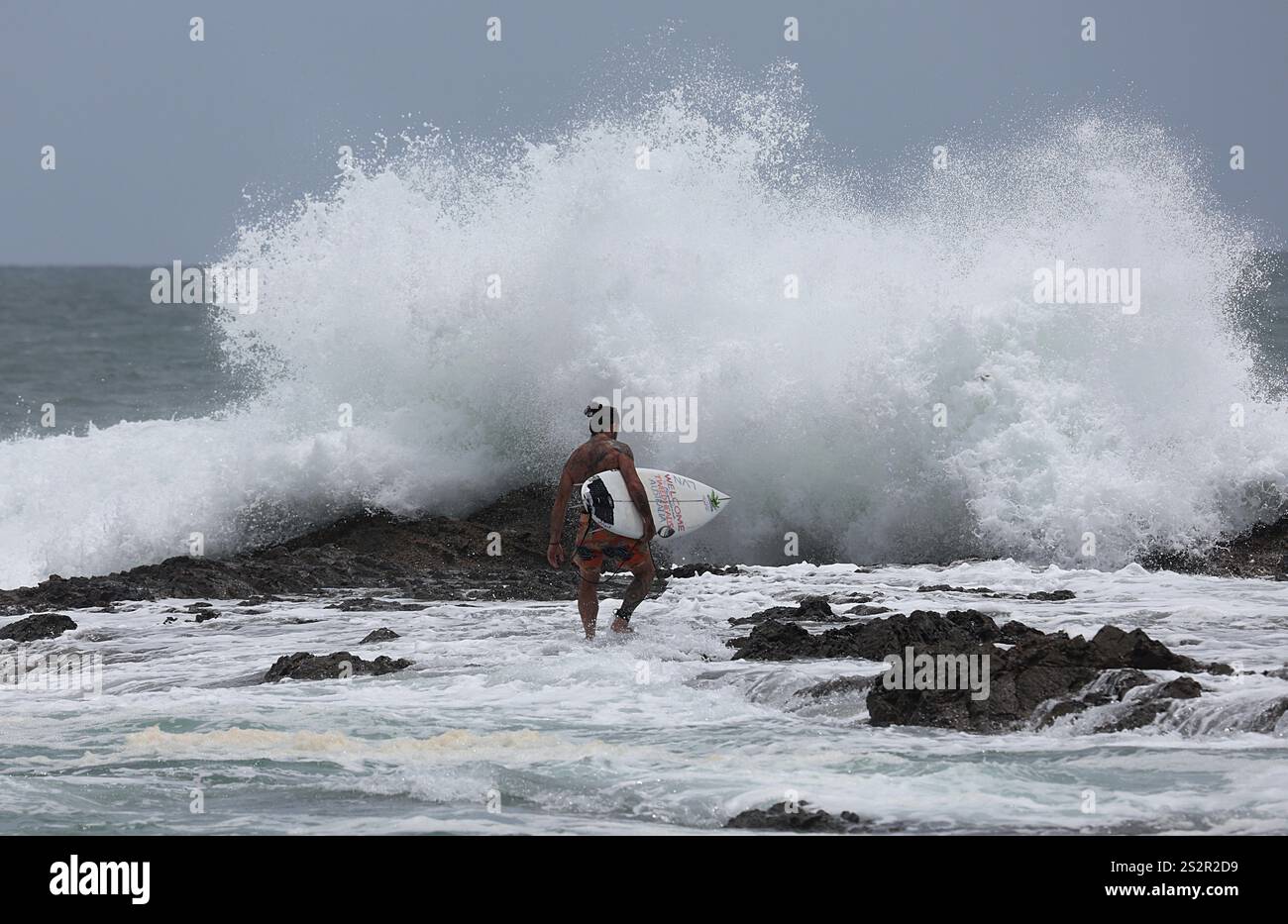 Australia. 18th Dec, 2024. A Surfer is seen at Snapper Rocks in ...