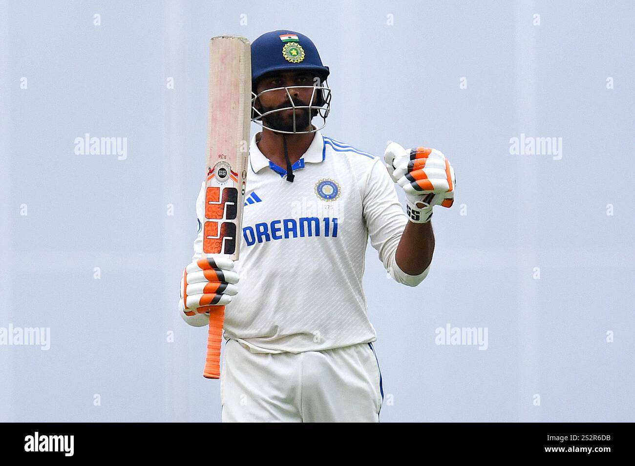 Brisbane, Australia. 17th Dec, 2024. Ravindra Jadeja of India brings up ...