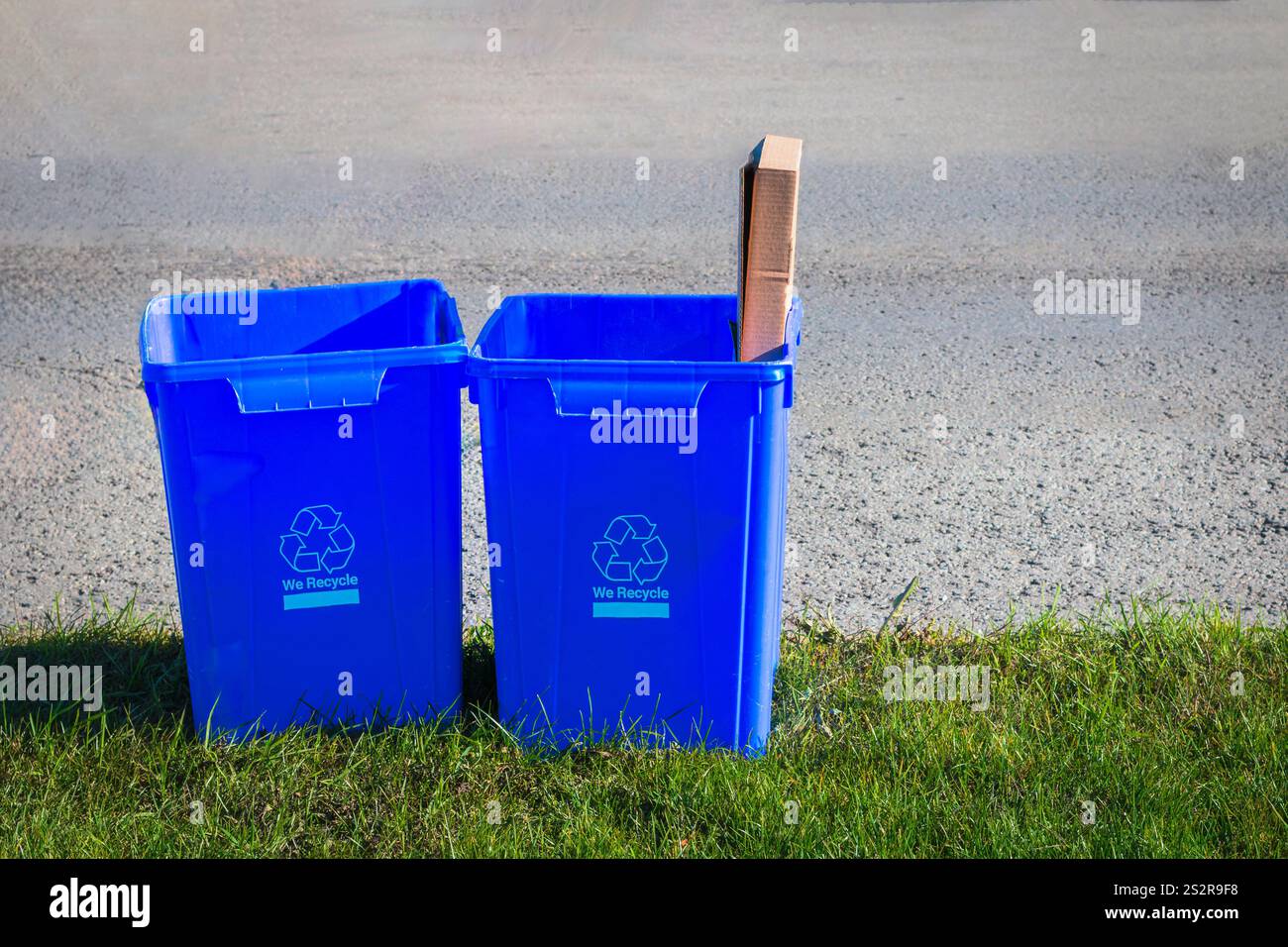 recycle bins at curb side waitingfor pick up in the city Stock Photo ...