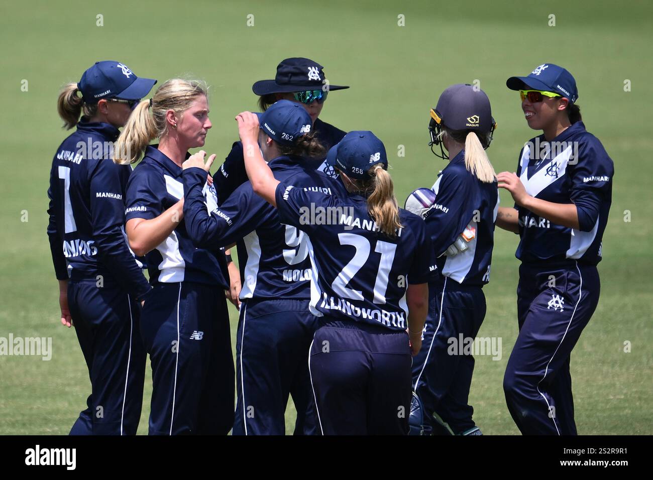 Sophie Day of Victoria (2nd left) celebrates taking the wicket of ...