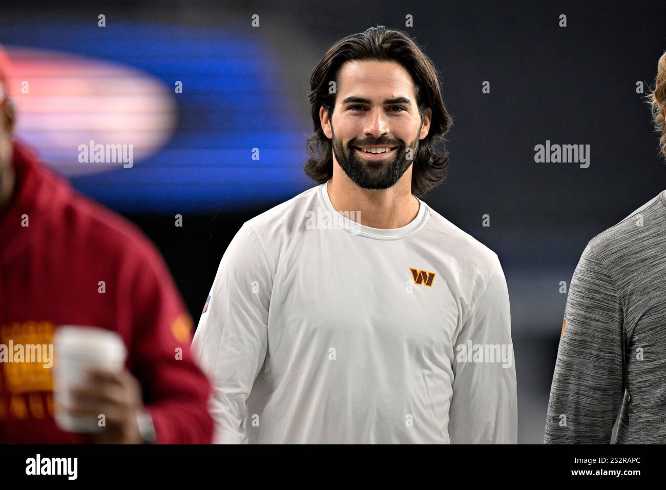 Washington Commanders quarterback Sam Hartman walks on the field before ...