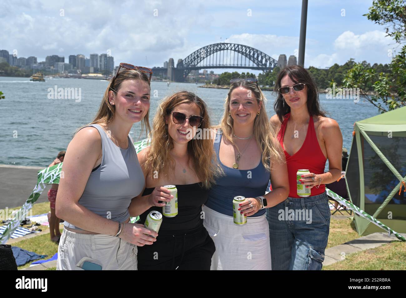 English friends Coco, Meg, Alice and Amy pose for a photograph before ...