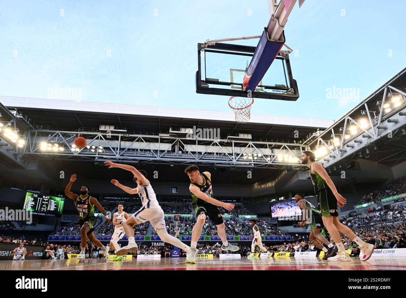 Derrick Walton Jr of the Phoenix (left) gathers a loose ball during the ...