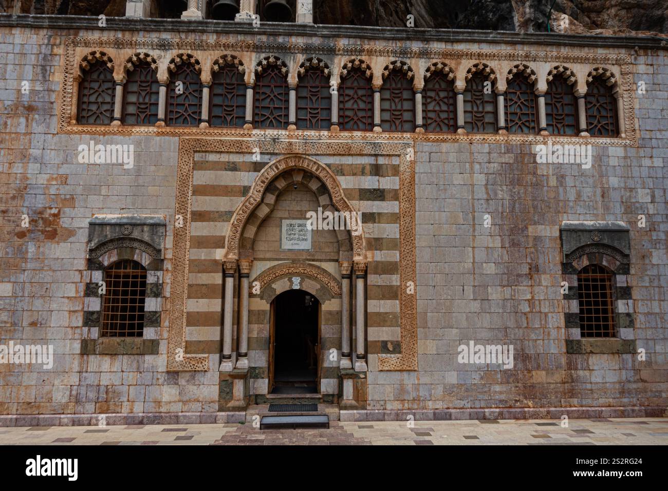 The front facade of a magnificent building featuring beautiful arches ...