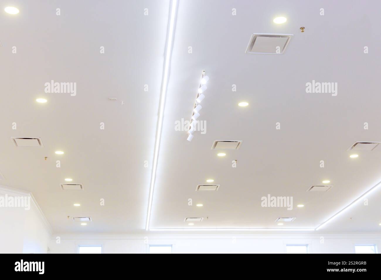 Brightly lit interior featuring installed ceiling lights clean, minimal ...
