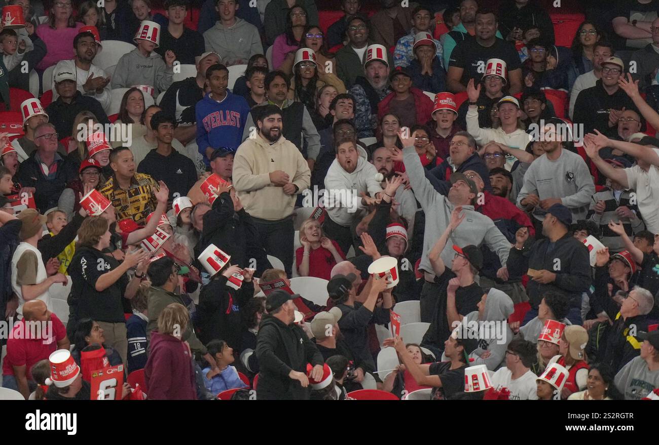 Members of the crowd attempt to catch a six during the Big Bash League ...