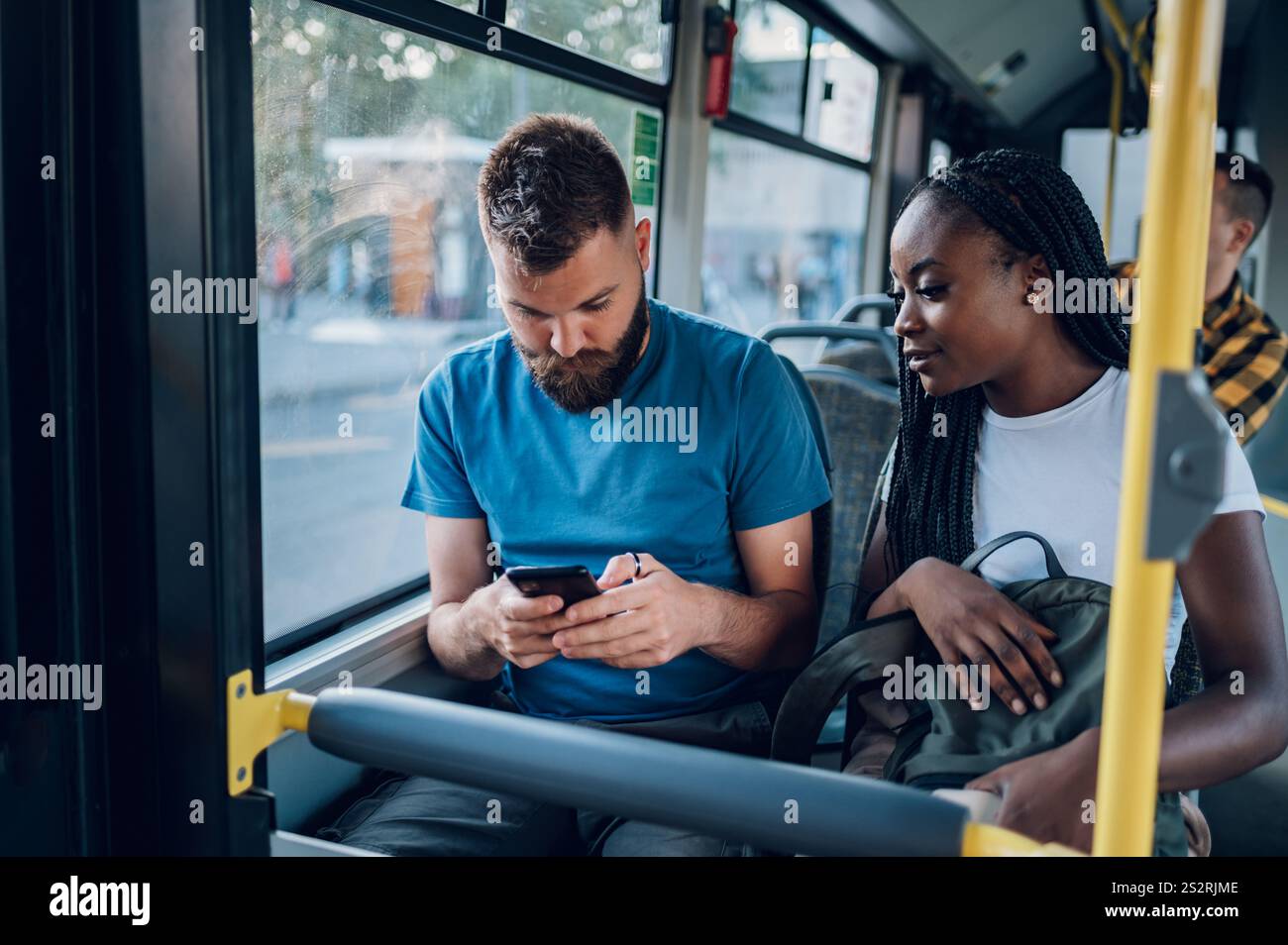 Woman typing in smartphone riding hi-res stock photography and images ...