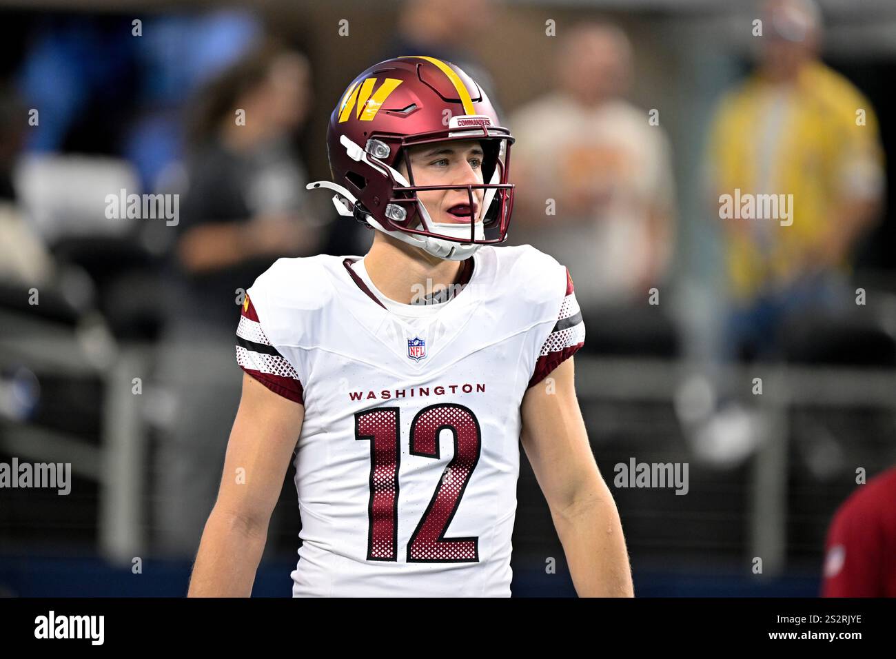 Washington Commanders wide receiver Luke McCaffrey (12) warms up before ...