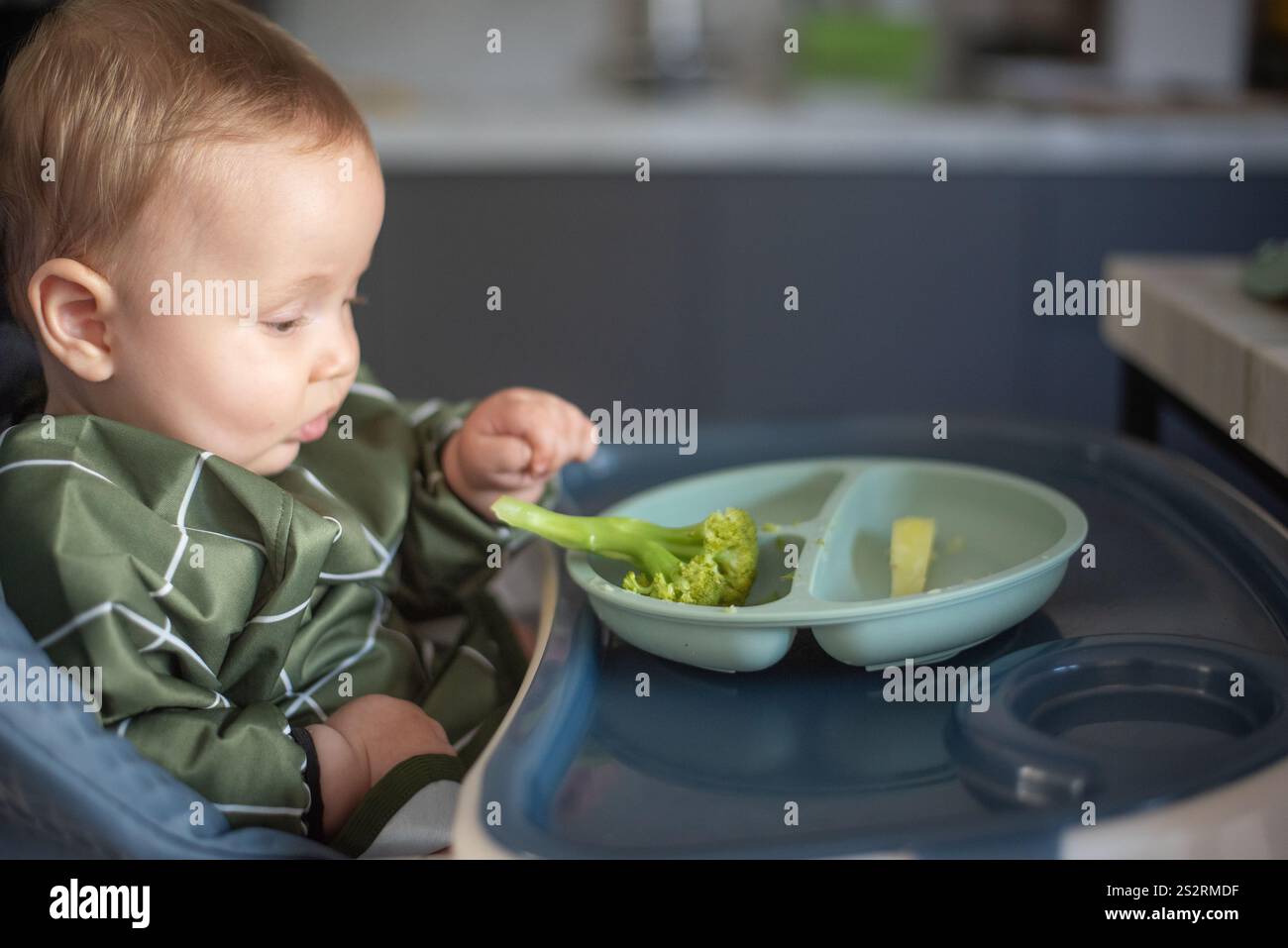 Baby's first lunch during introduction to solids Stock Photo - Alamy