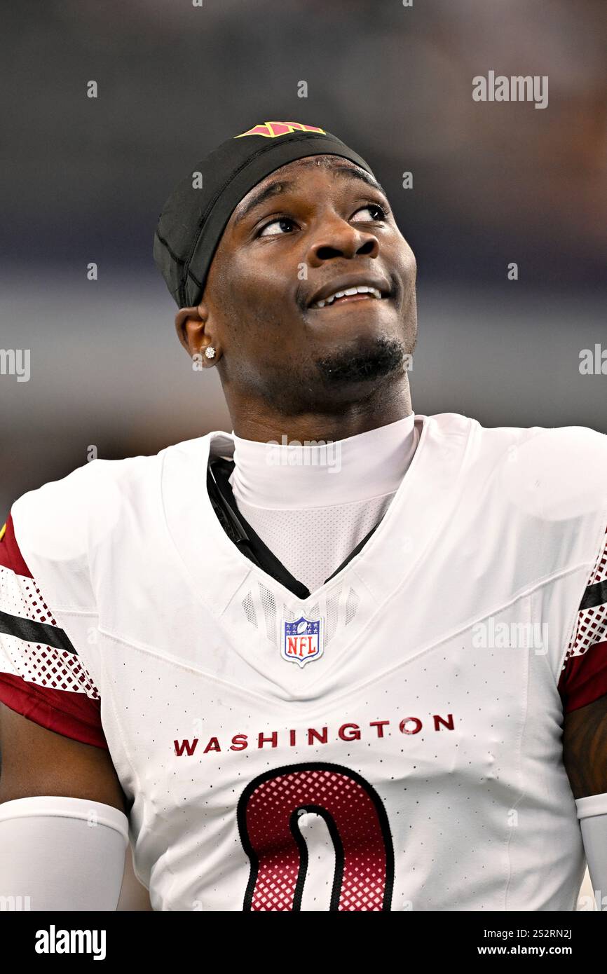 Washington Commanders cornerback Mike Sainristil (0) warms up before an ...