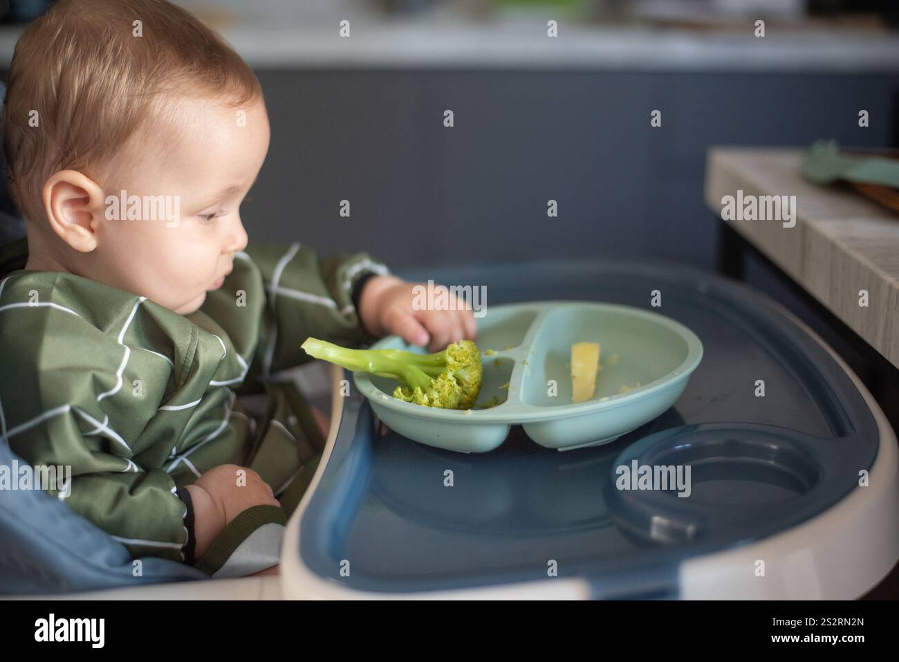 Baby's first lunch during introduction to solids Stock Photo - Alamy