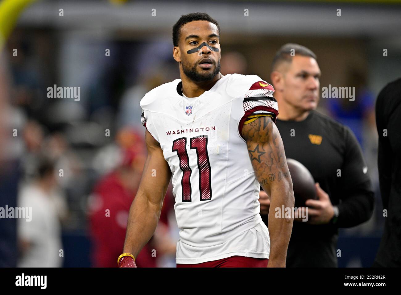 Washington Commanders safety Jeremy Chinn (11) warms up before an NFL ...