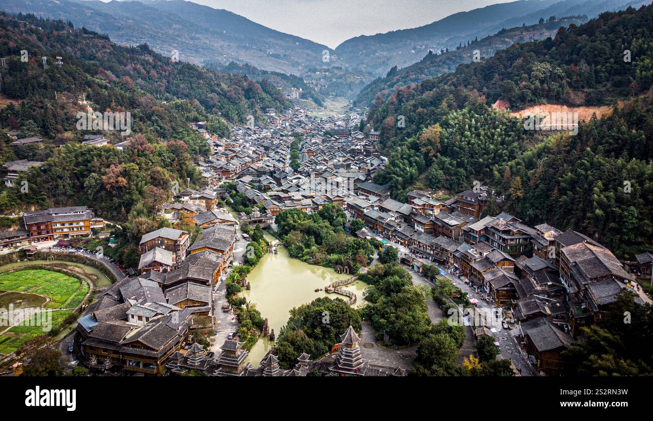 Aerial view of Zhaoxing Dong Village. Valley surrounded by mountains in ...