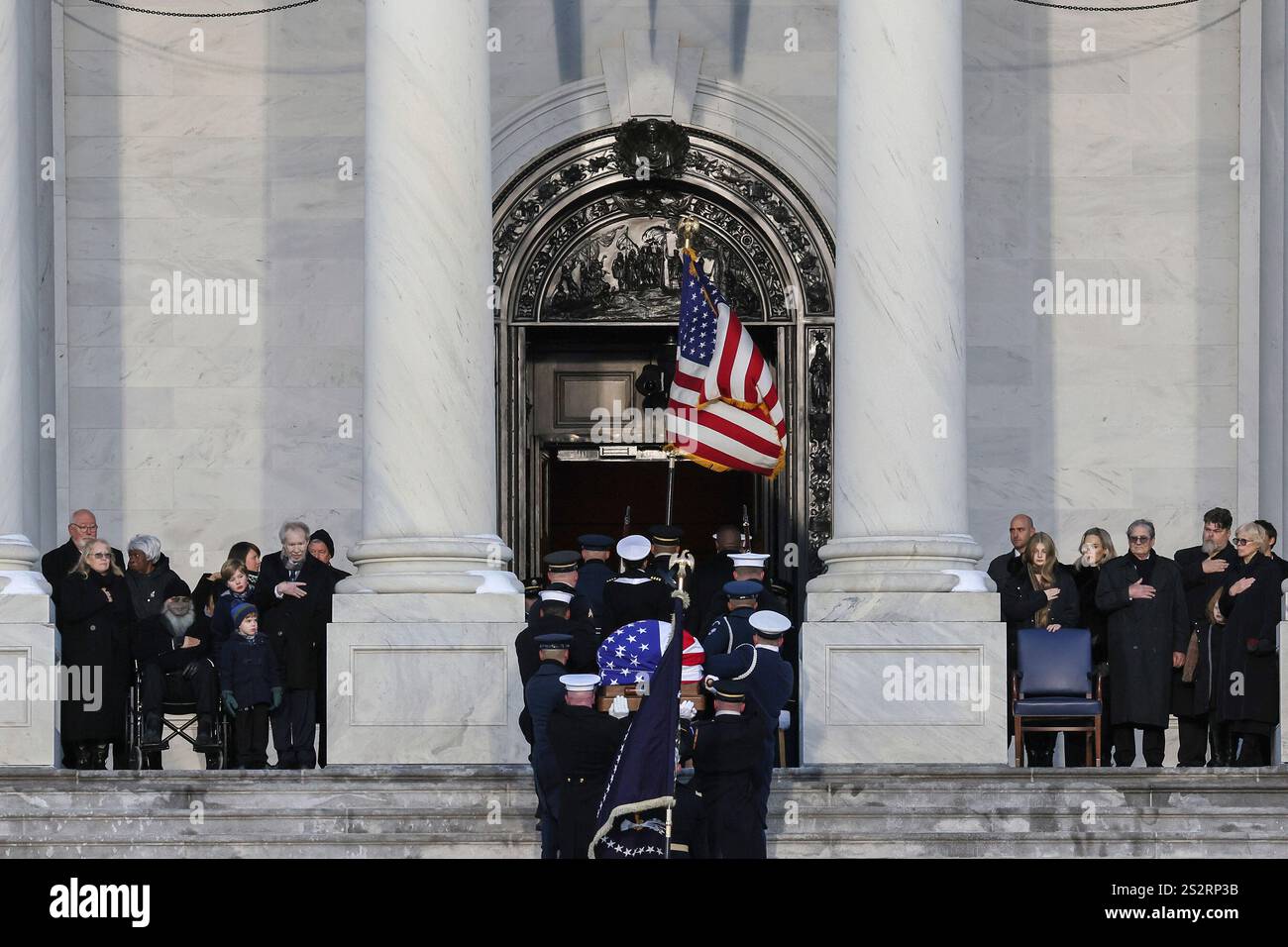 Members of the Carter family look on as U.S. Military joint force ...