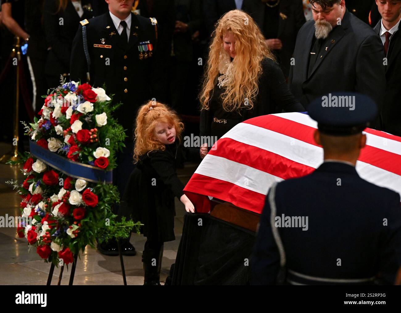 WASHINGTON, DC - JANUARY 7: Mourners touch the casket of former ...