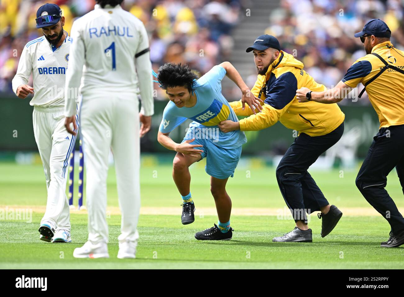 A pitch invader enters the field of play during the Fourth Test match ...