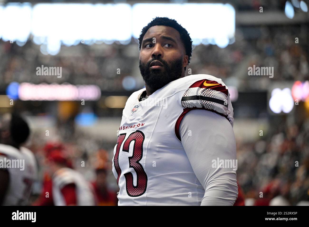 Washington Commanders offensive tackle Trent Scott (73) looks on from ...
