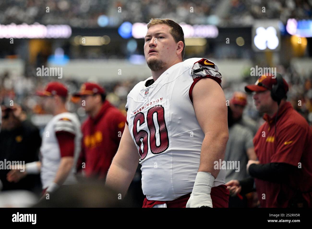 Washington Commanders guard Michael Deiter (60) looks on from the ...