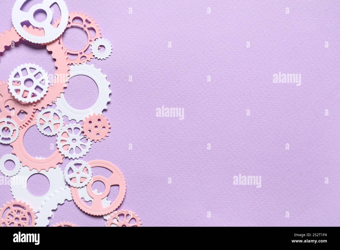 Different paper gears on lilac background Stock Photo - Alamy