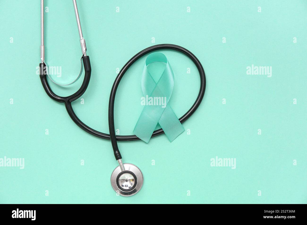 Turquoise ribbon with stethoscope on color background. Cervical Health ...