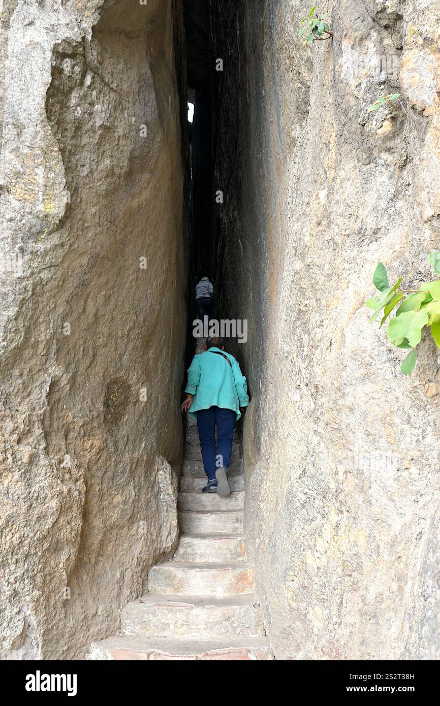 Narrow mountain wall fissure with steps and final ascent to Gurpa Hill ...