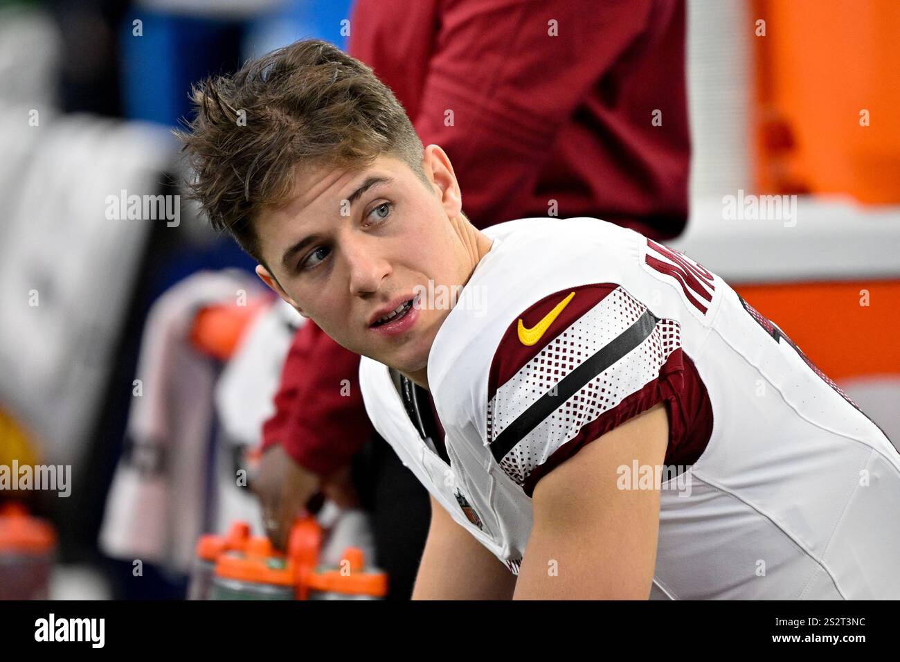 Washington Commanders wide receiver Luke McCaffrey (12) looks on from ...