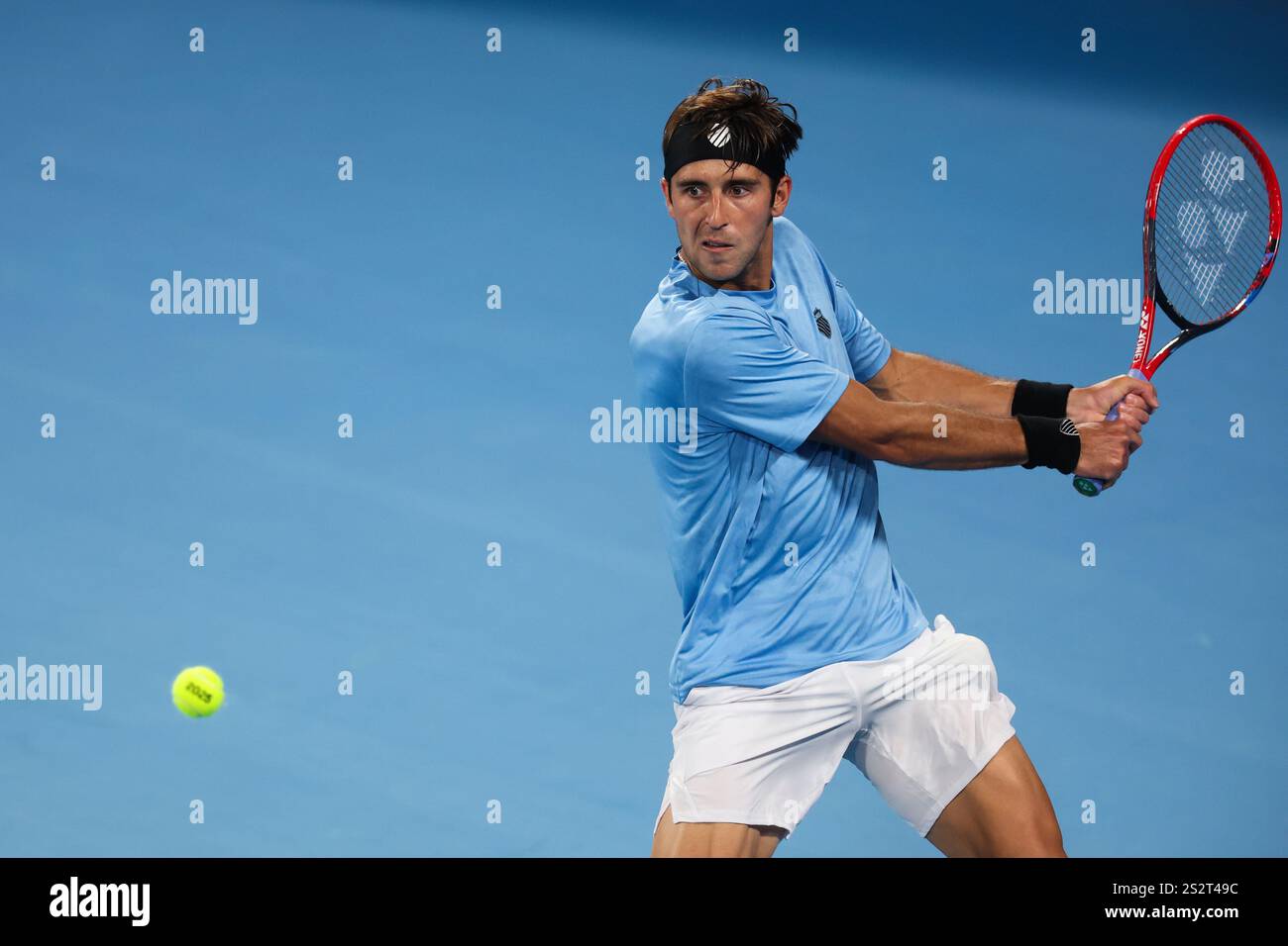 Tomas Martin Etcheverry of Team Argentina plays a backhand in his Group ...