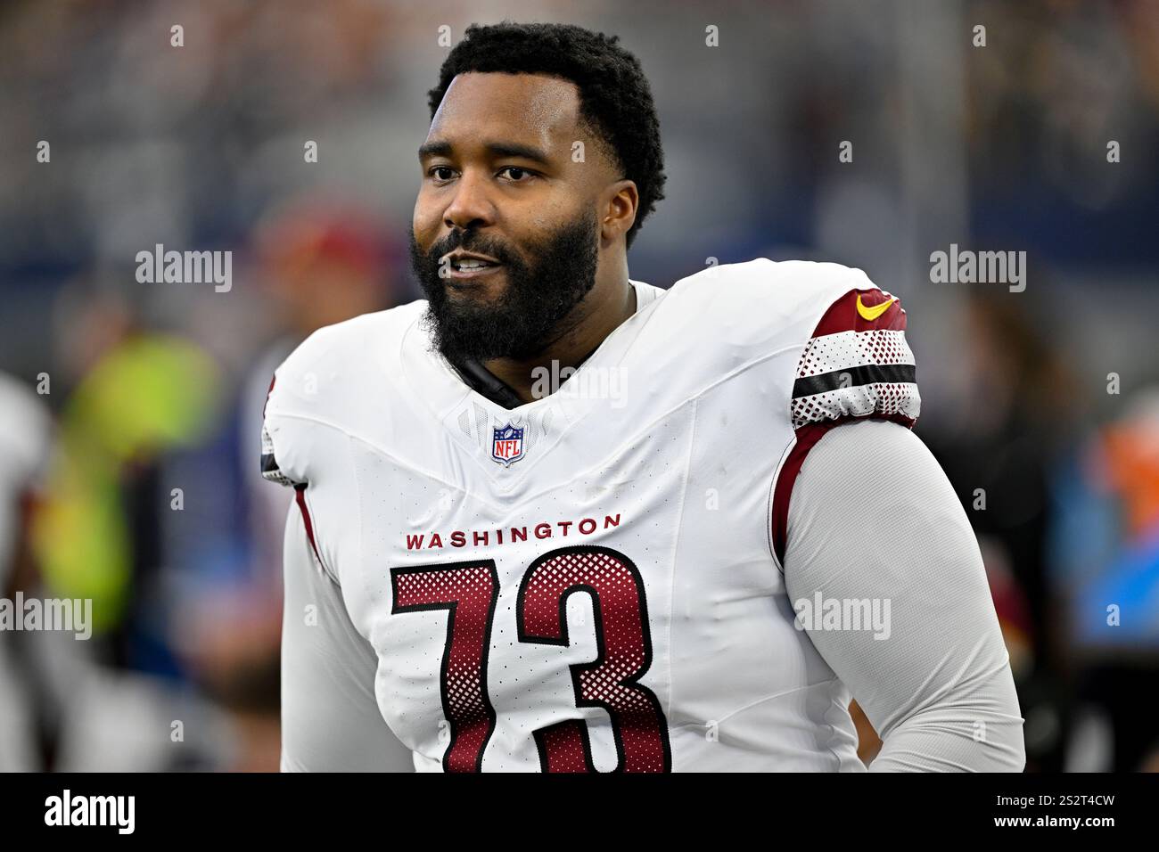 Washington Commanders offensive tackle Trent Scott (73) looks on from ...