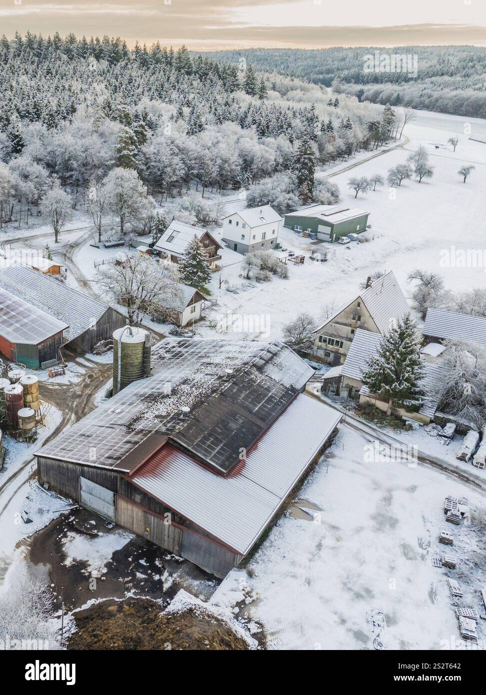 Detailed close-up of snow-covered buildings in a rural setting ...