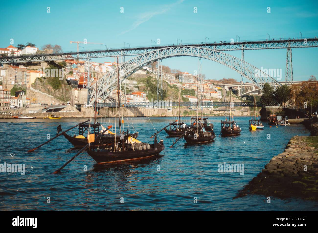 Traditional Rabelo boats carrying wine barrels on the Douro River in ...
