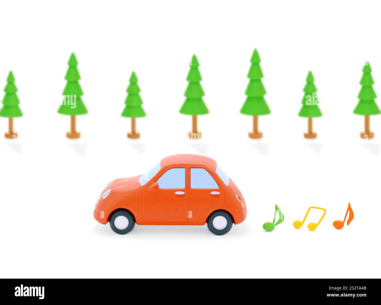Red clay car with music notes and street trees Stock Photo - Alamy
