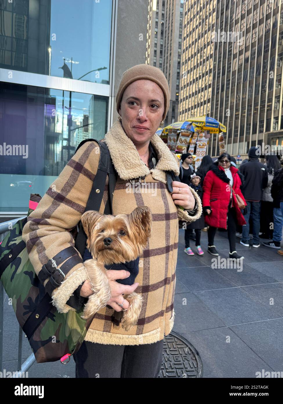 New York, USA. 08th Jan, 2025. A woman waiting to join the long queue ...