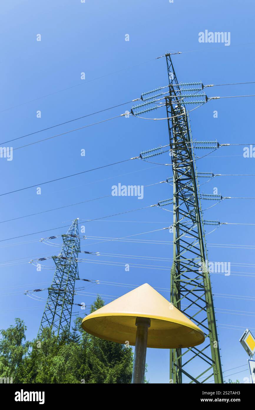 A gas pipeline and an electricity pylon of a high-voltage power line ...