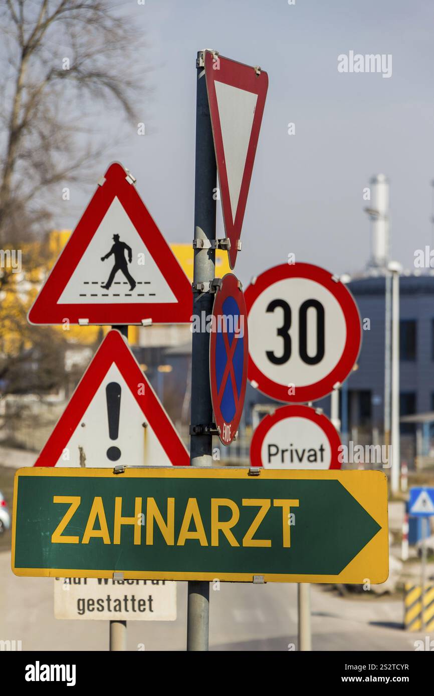 A forest of traffic signs and signs makes it confusing for drivers in ...