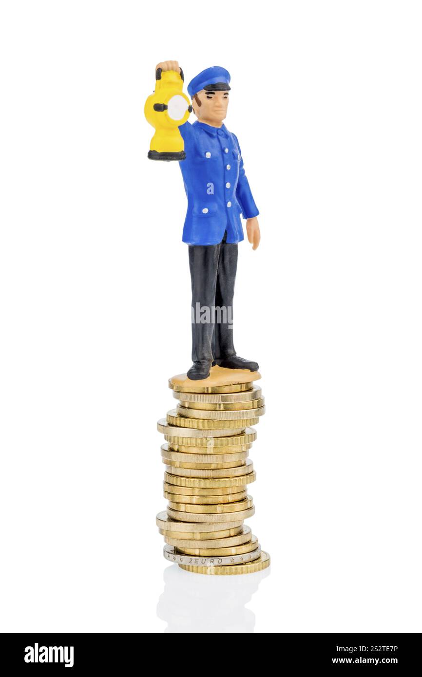 Railway employee on pile of money, symbolic photo for early retirement ...