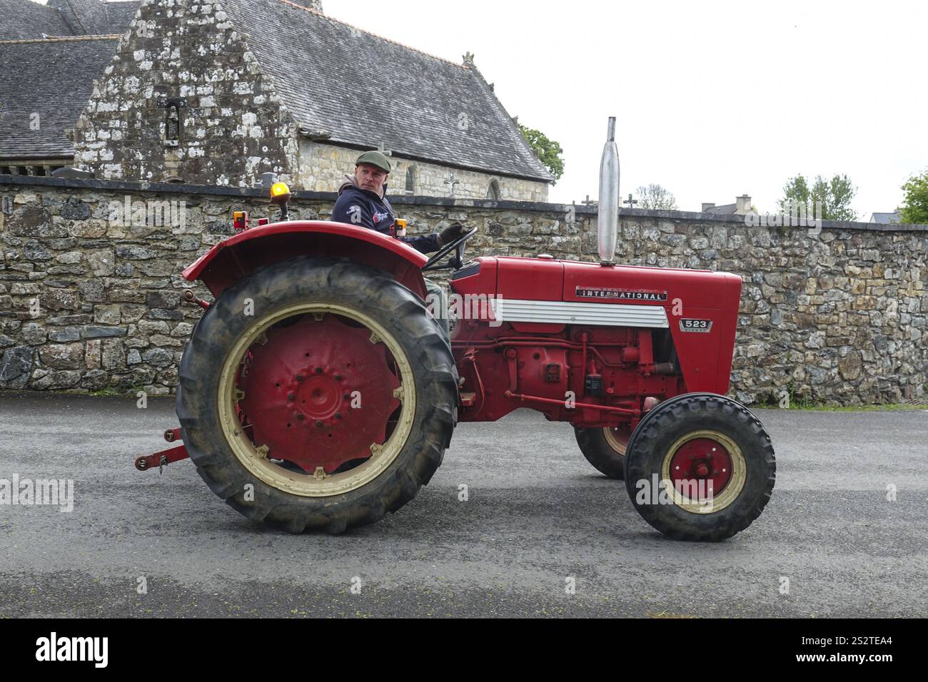 Old tractor Mc Cormick International 523 in front of church and chapel ...