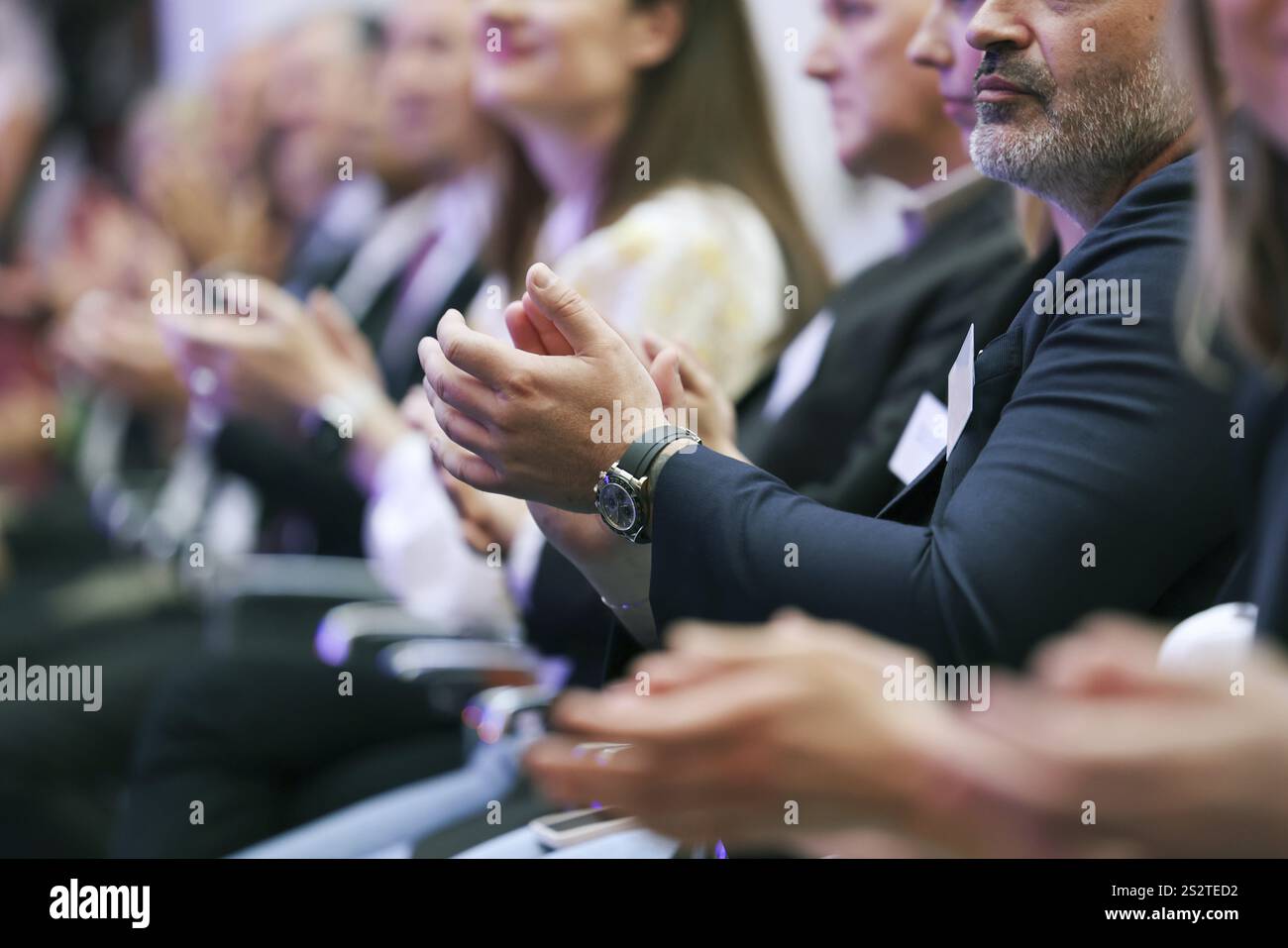Applause, clapping hands, audience applauding at a lecture for business ...