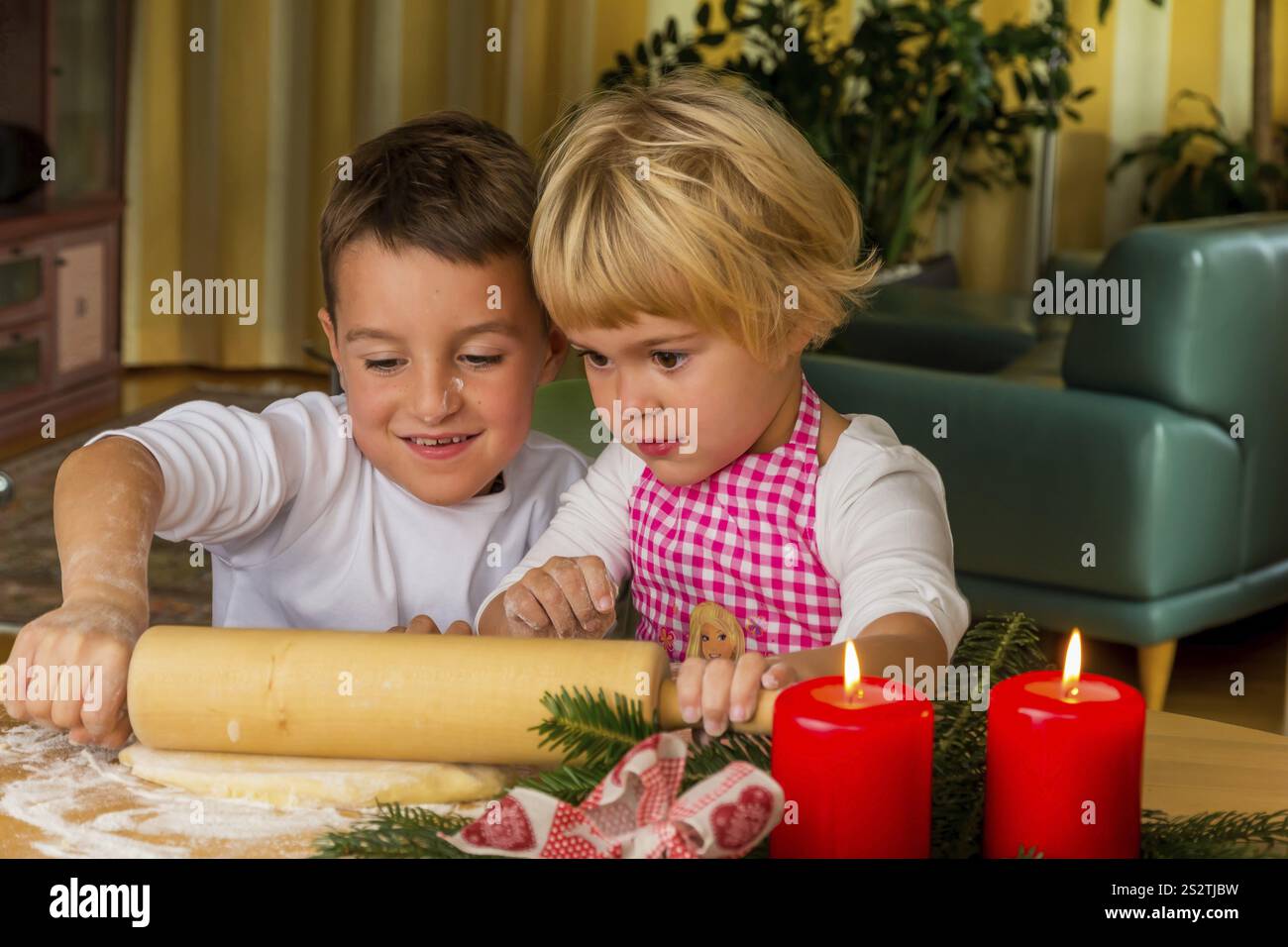 Children bake biscuits for Christmas. Biscuits for the Advent season ...